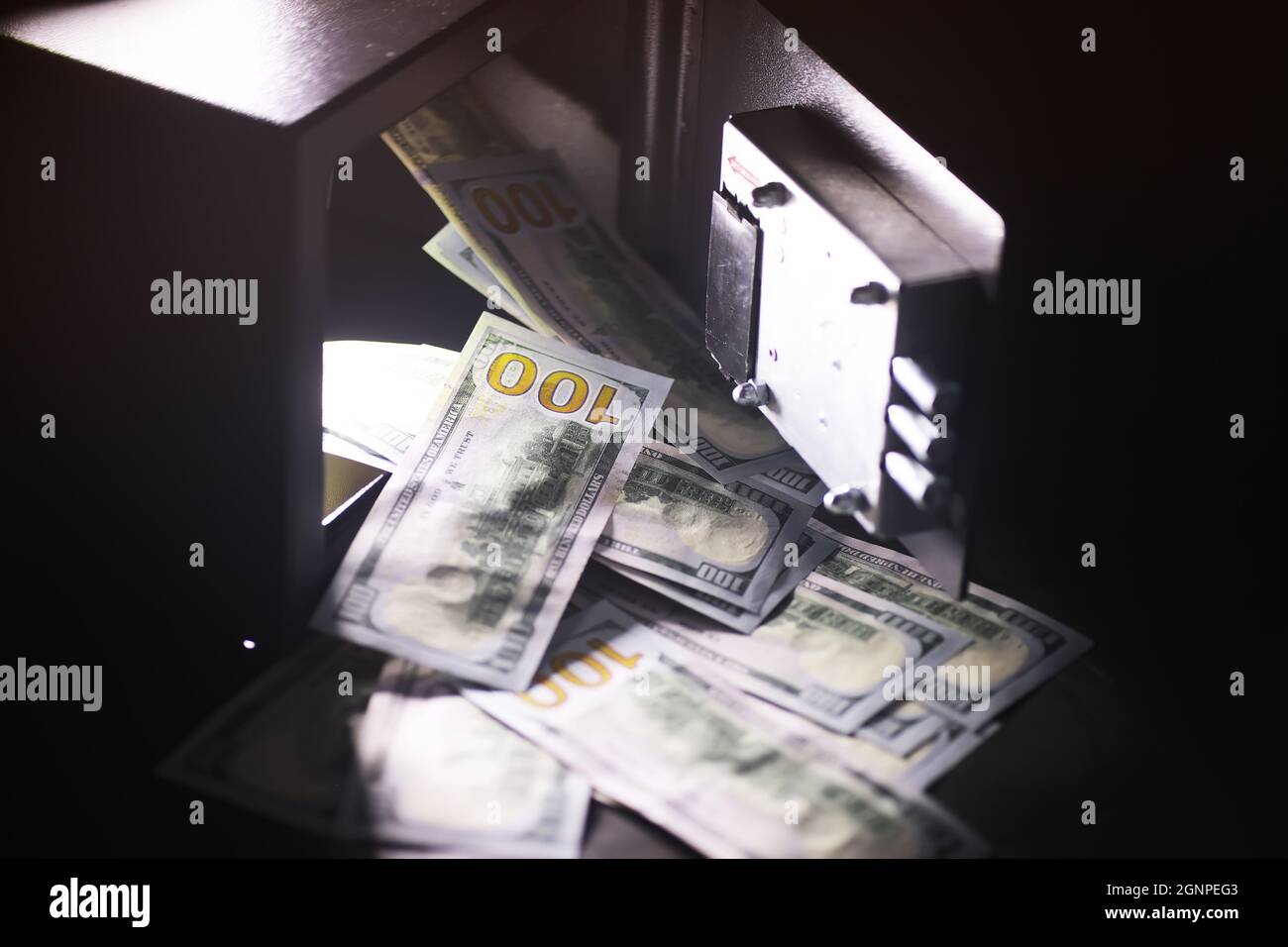 Steel safe with money. Hand putting password in the safety money box in ...