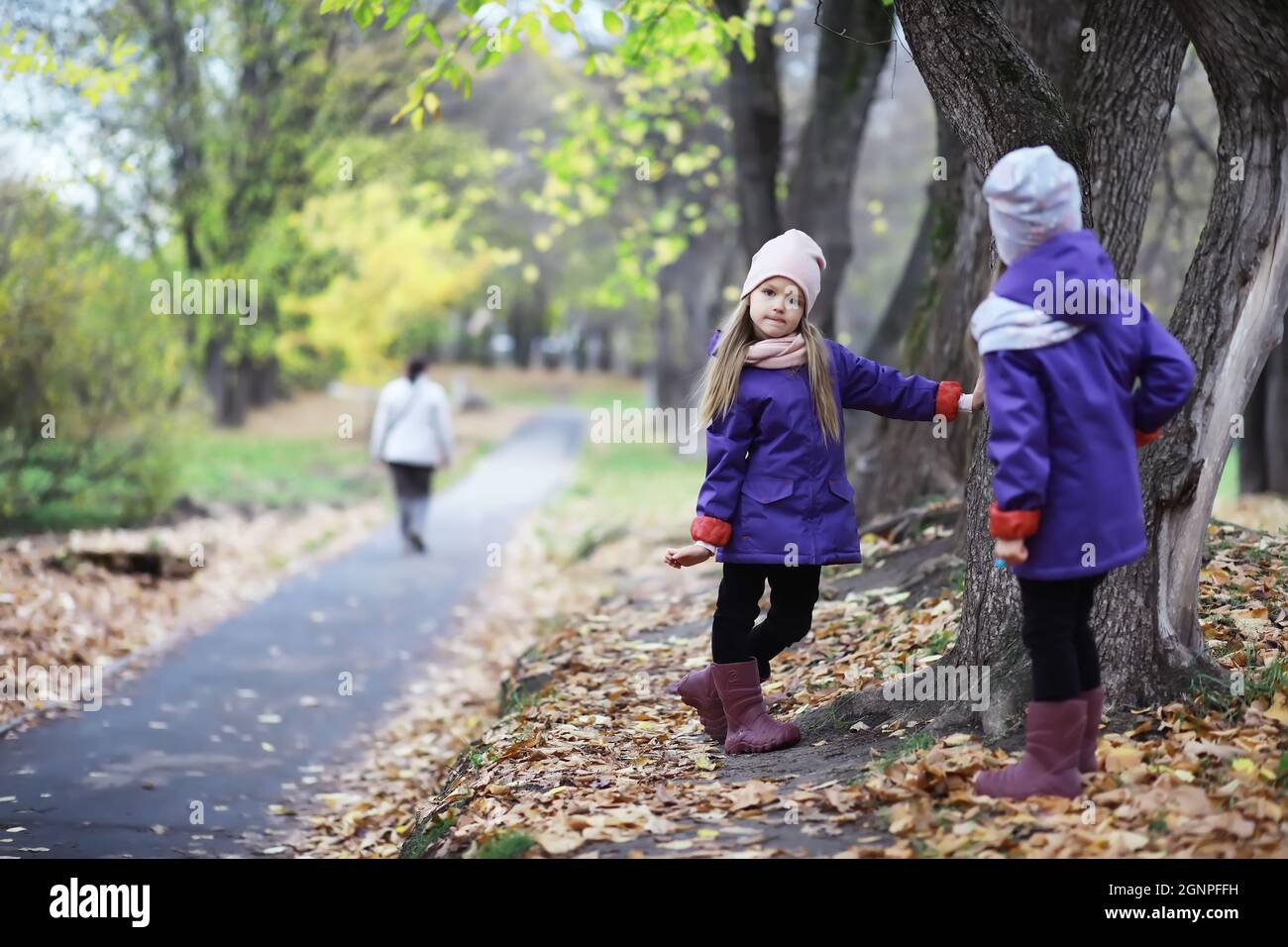 Children for a walk in autumn park. Leaf fall in the park. Family. Fall ...