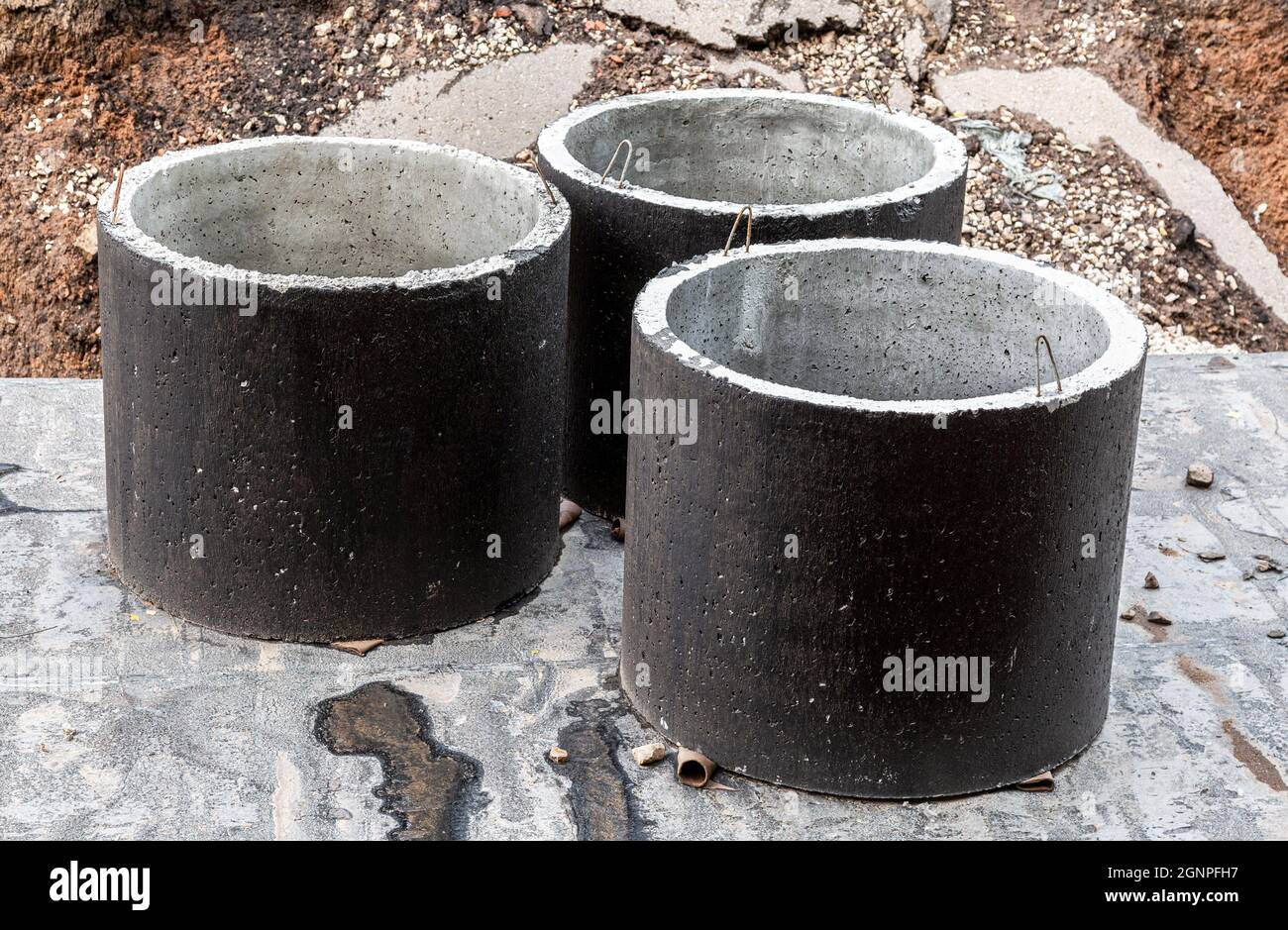 Large concrete rings on the construction site for replacement of ...