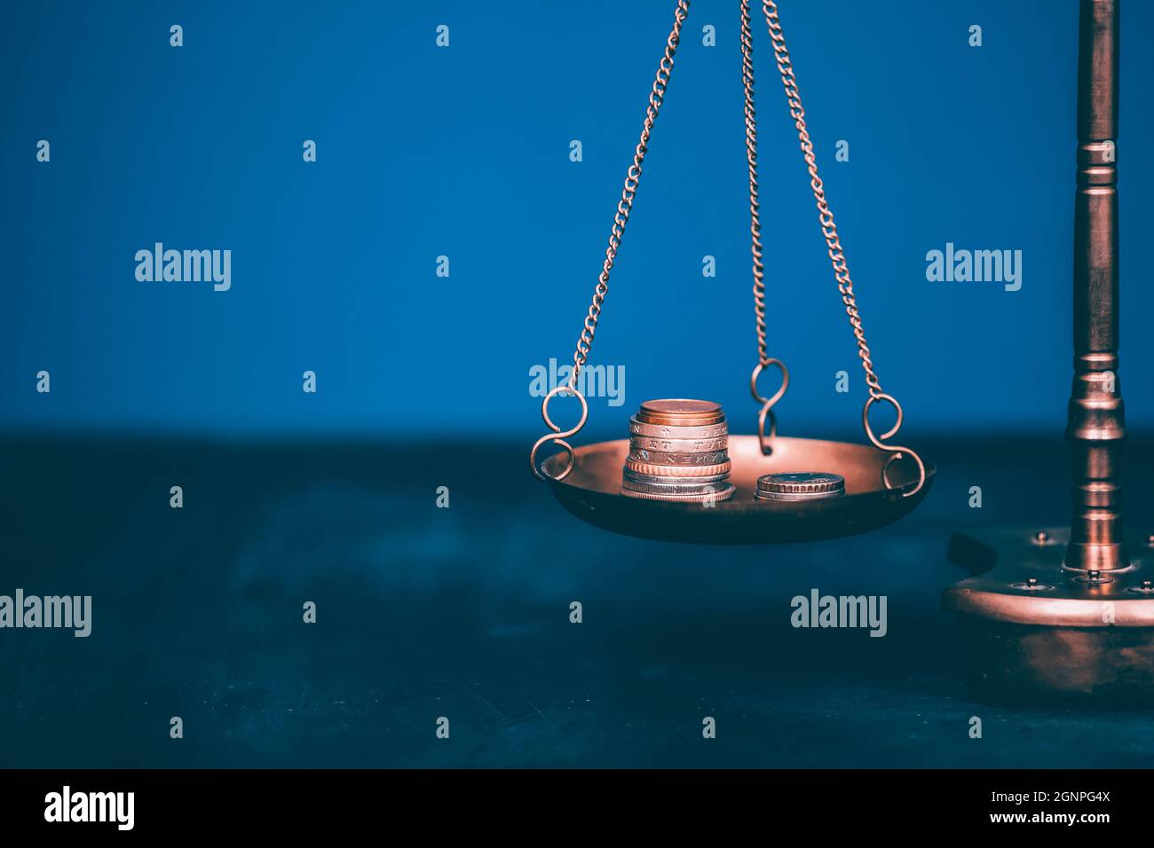 Balance scale with coin stacks. Money management, time value of money ...