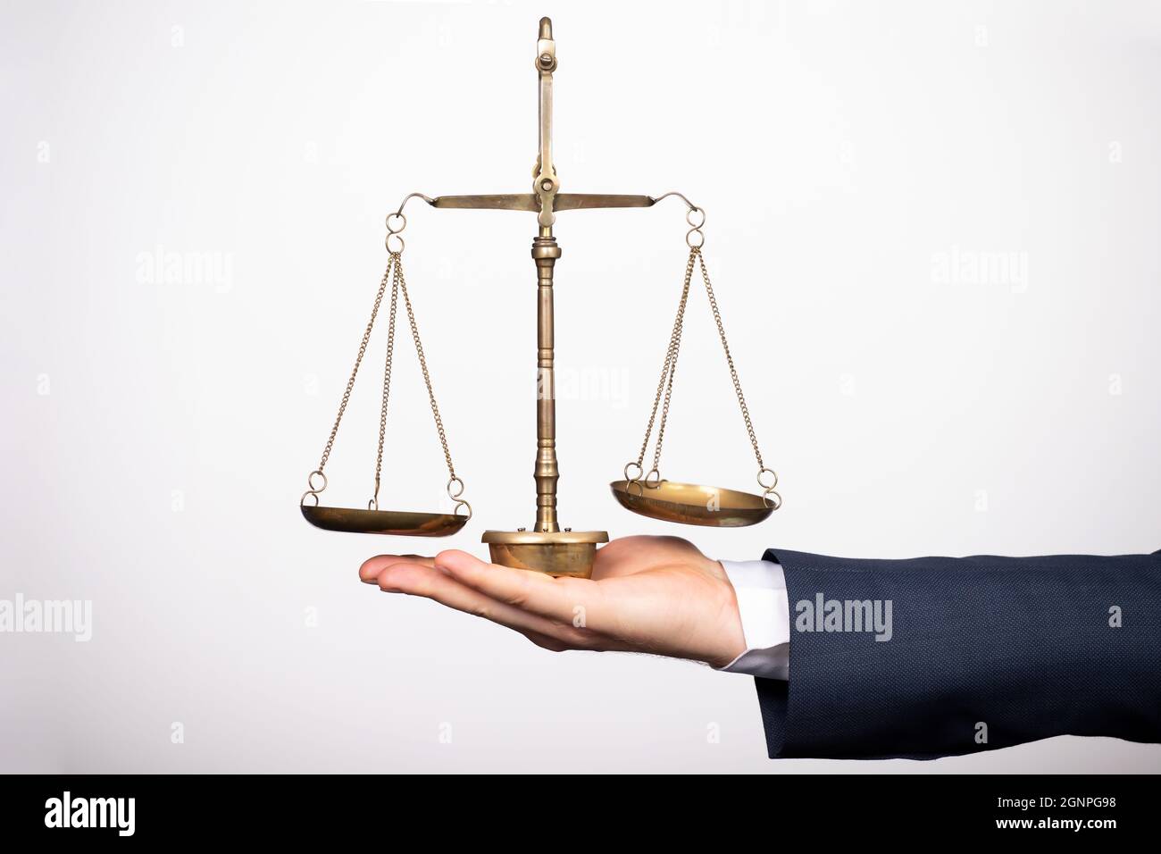 Weight scale of justice, lawyer in background. Justice, law, attorney ...