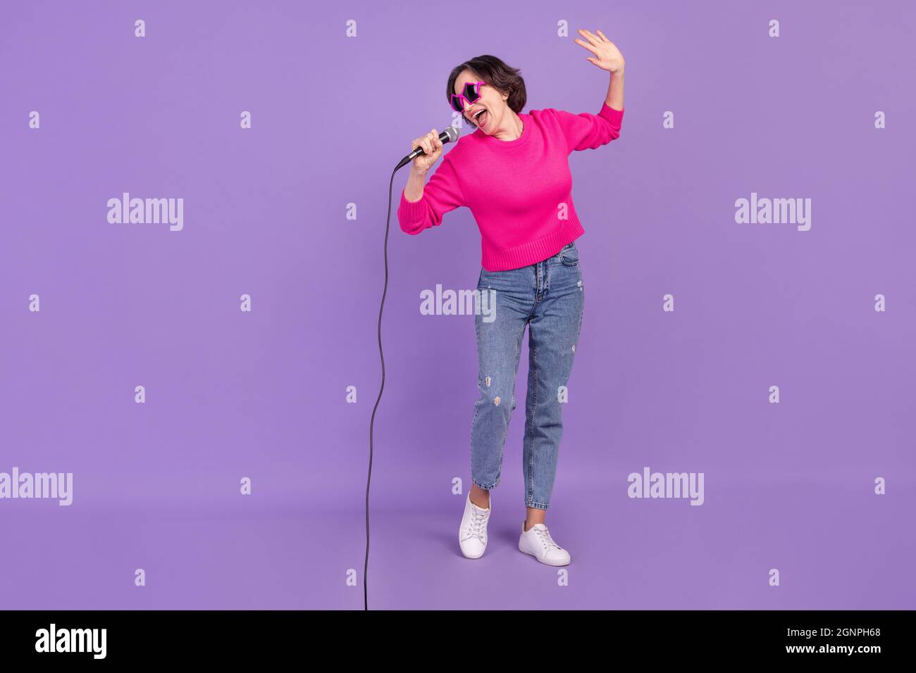 Full length body size view of attractive talented woman singing hit ...