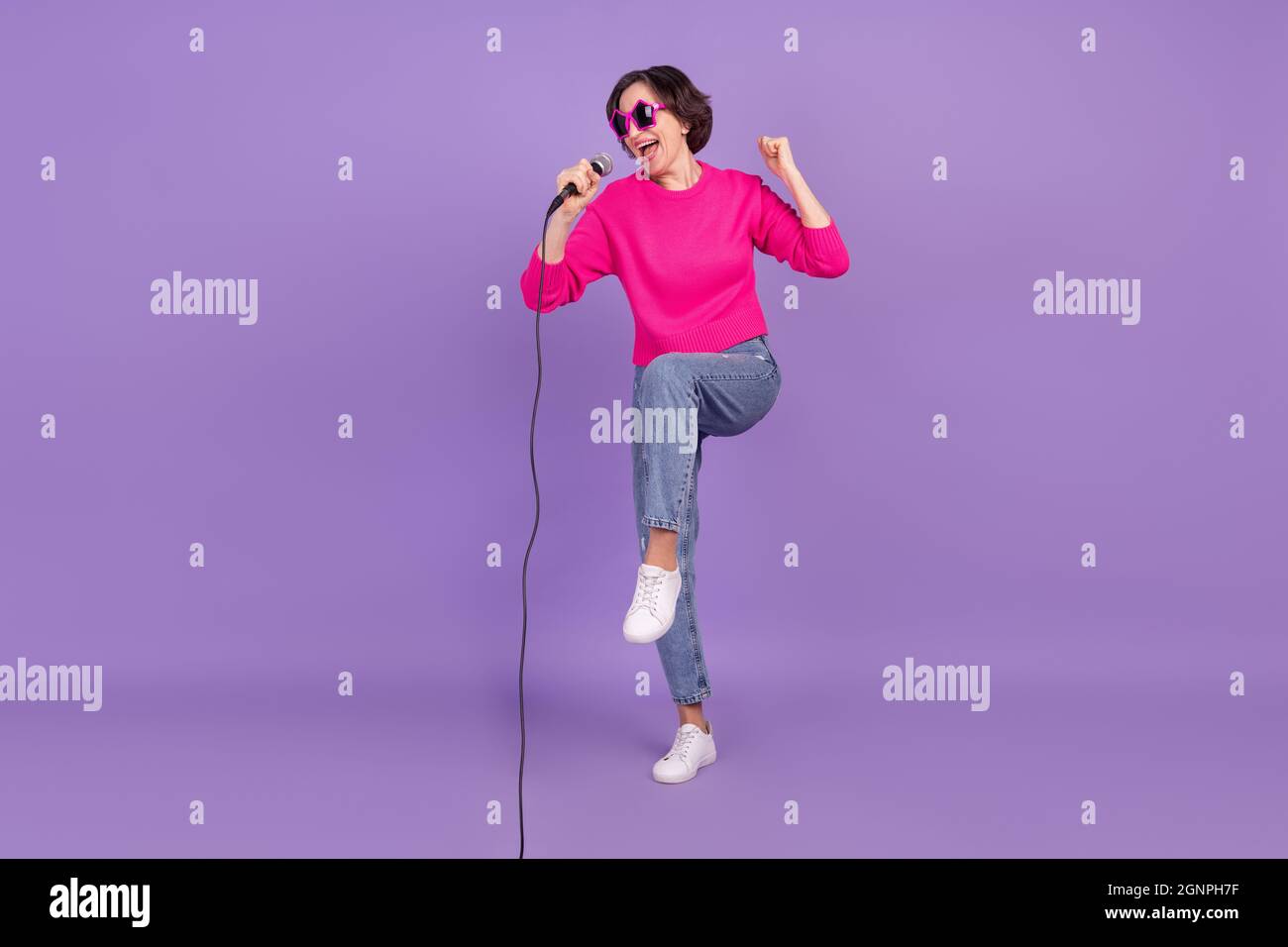 Full size photo of elderly woman happy positive smile sing song mic ...