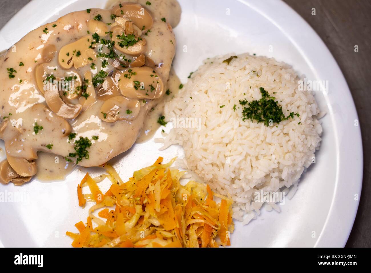 Aerial photo of mixed dish of rice with meat accompanied by mushroom ...