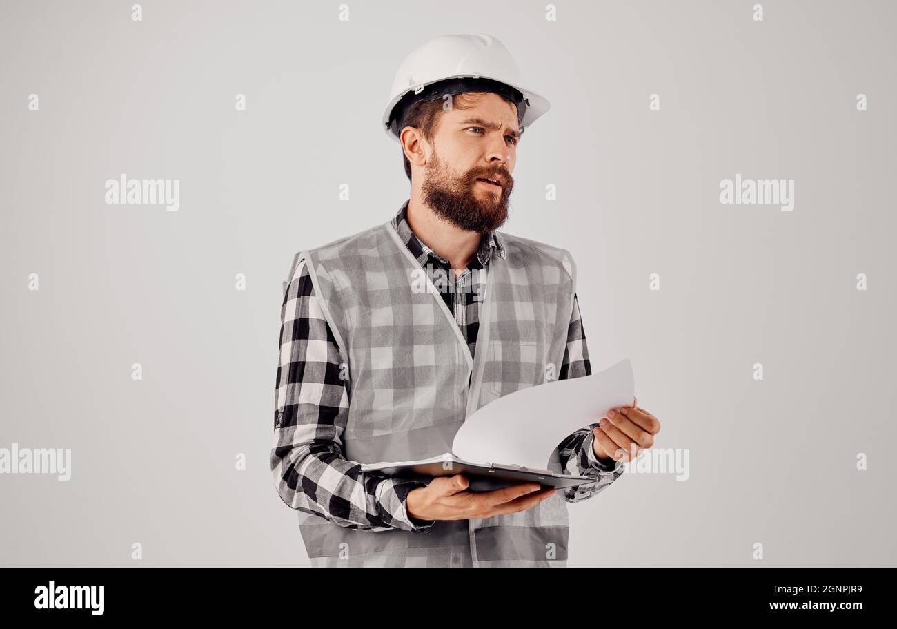 engineer in a white helmet blueprints Professional light background ...