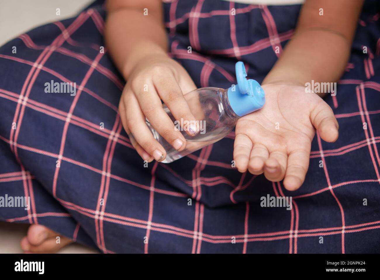 child hand using sanitizer gel for preventing virus with copy space ...