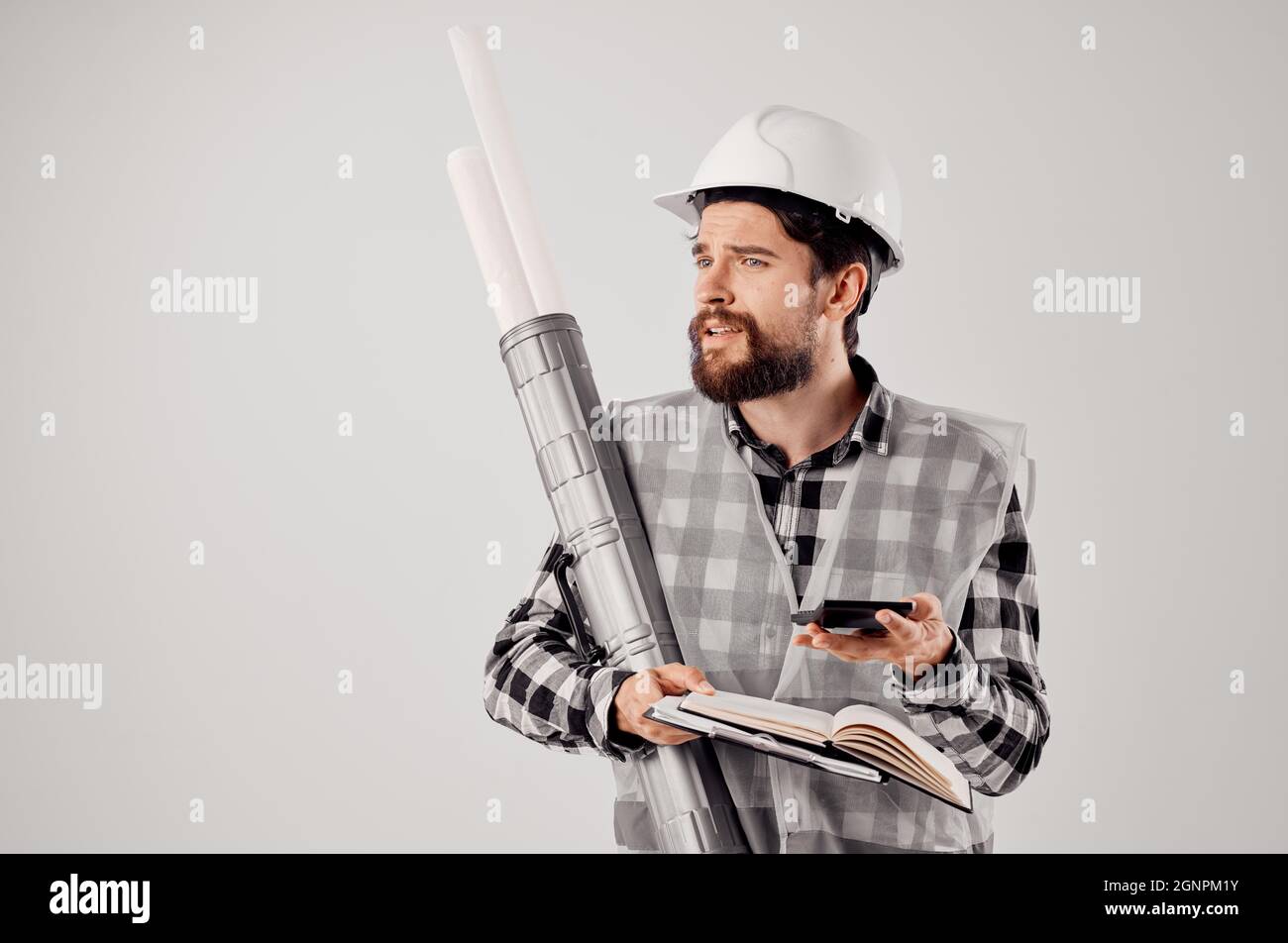 engineer in an orange helmet blueprints Professional light background ...