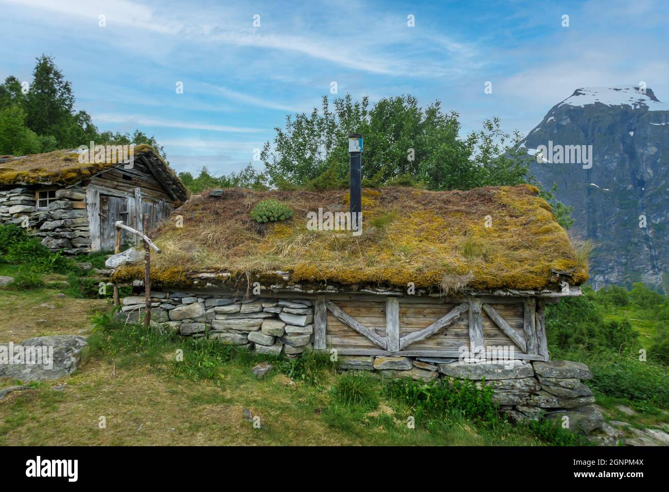 GEIRANGER, NORWAY- 2020 JUNE 21. Homlong farm built in stone and grass ...