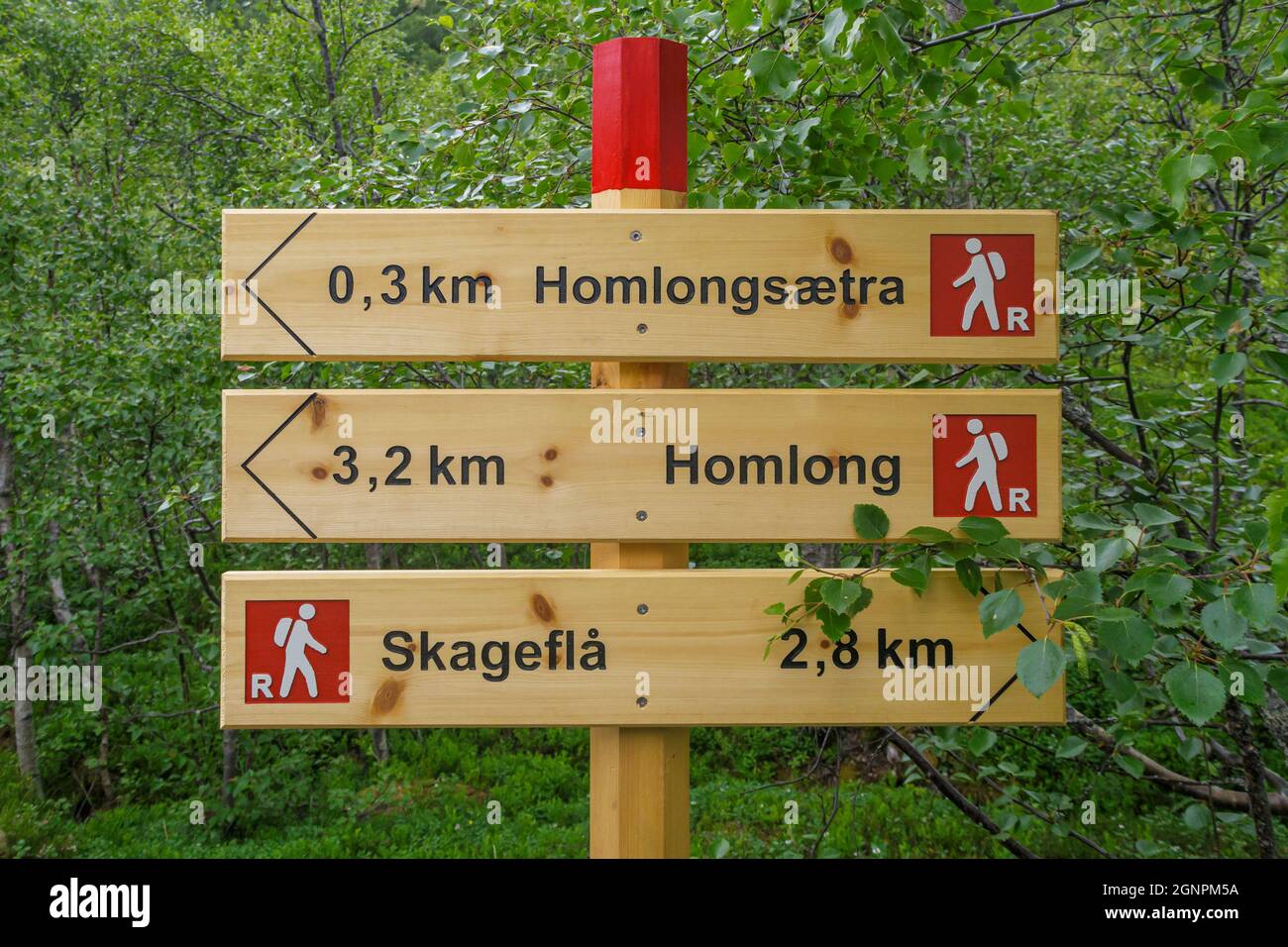 GEIRANGER, NORWAY- 2020 JUNE 21. Hiking post showing route direction to ...