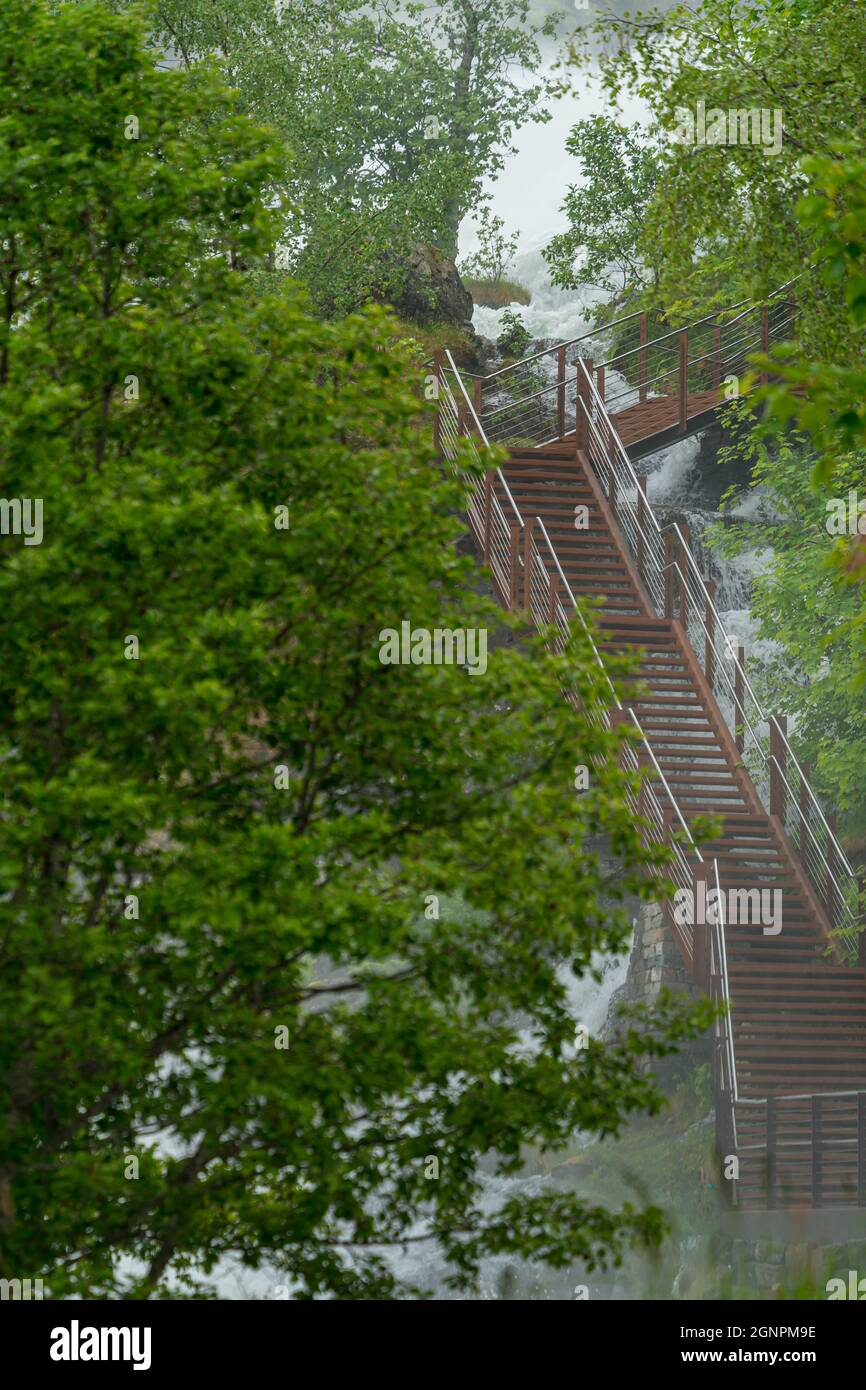 GEIRANGER, NORWAY - 2020 JUNE 21. Iron stairs close to the waterfall in ...