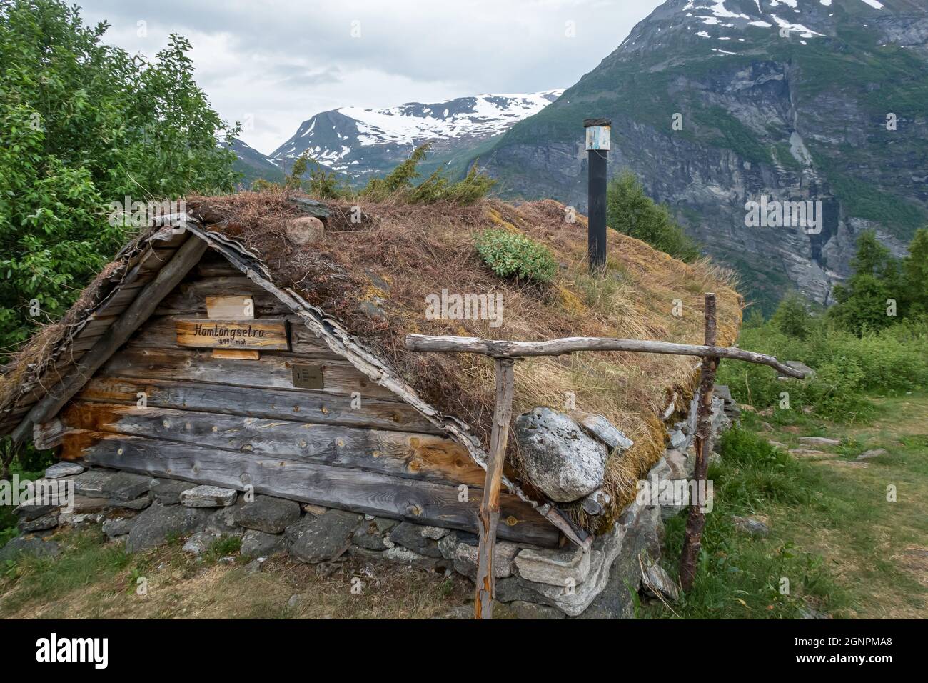 GEIRANGER, NORWAY- 2020 JUNE 21. Homlong farm built in stone and grass ...