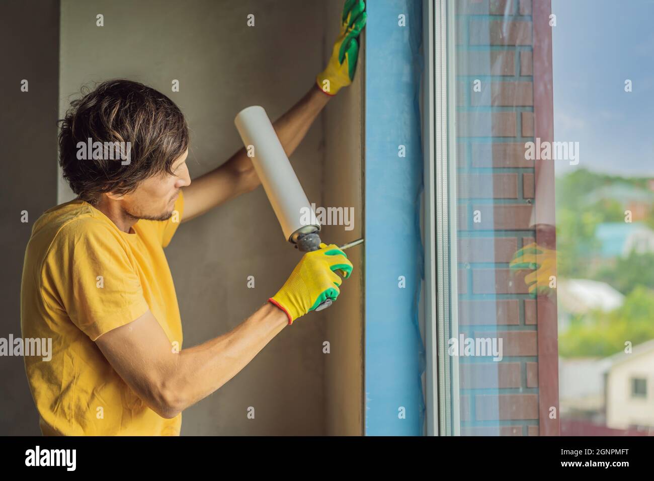 Builder or handyman is engaged in the repair or installation of windows ...