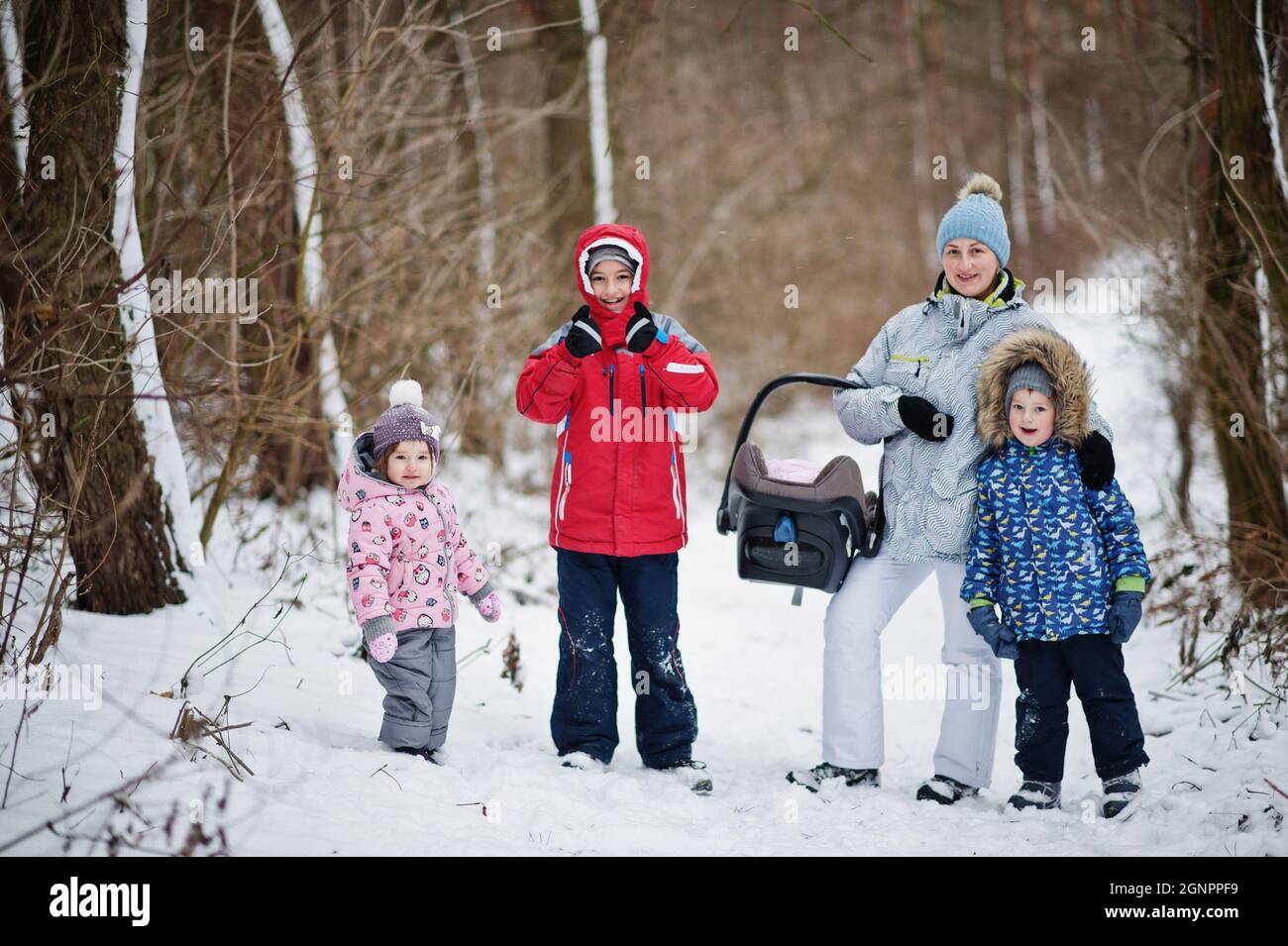 Mother with four kids at winter day Stock Photo - Alamy