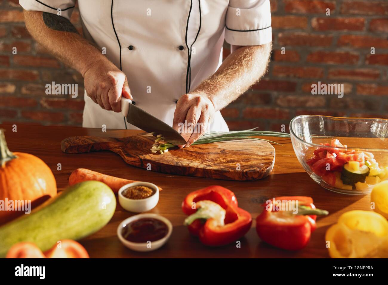 Kitchen worker cutting up cucumber hi-res stock photography and images ...