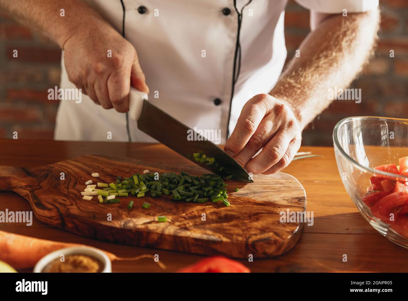 Kitchen worker cutting up cucumber hi-res stock photography and images ...