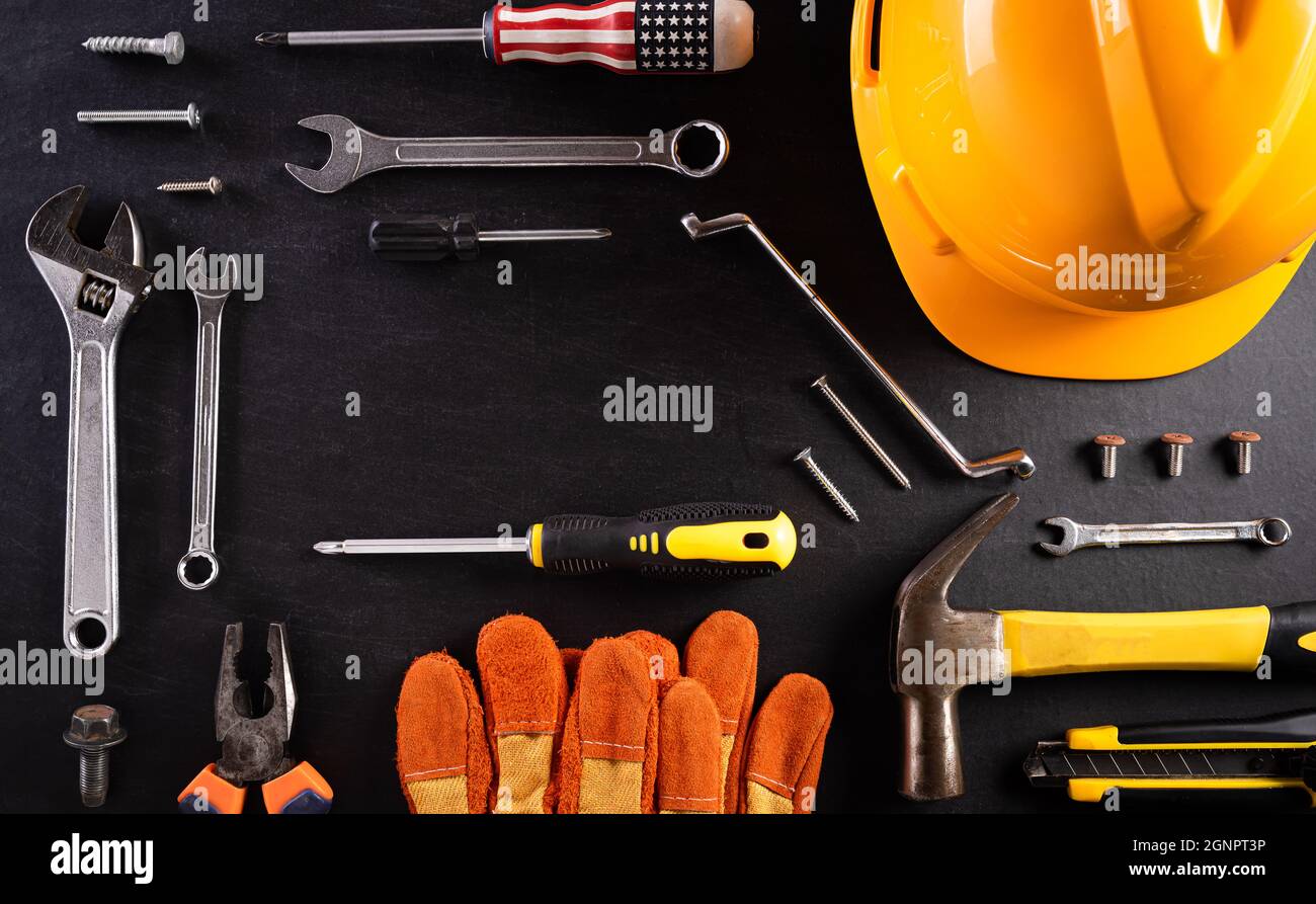 Happy Labor day concept. Different construction tools on black wooden ...