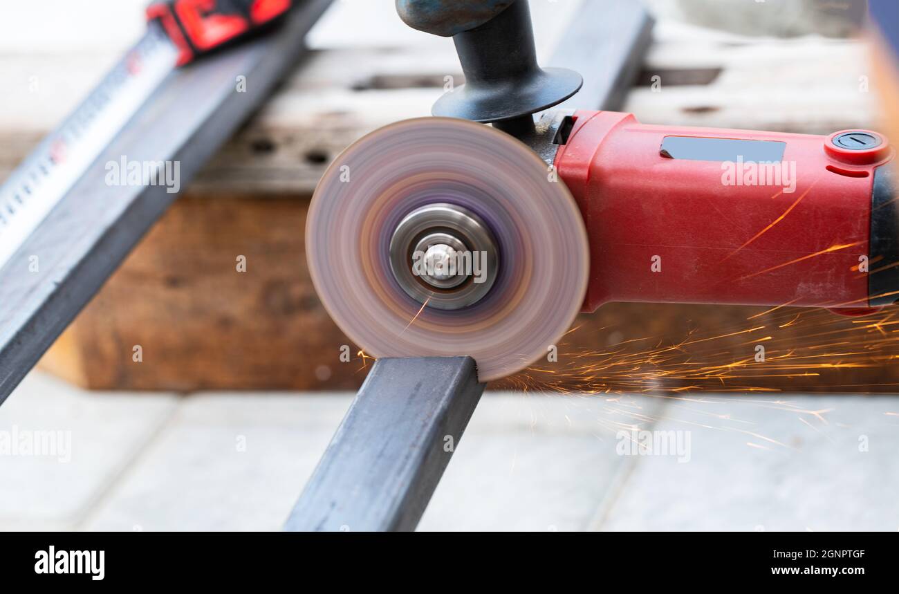 working with a circular saw cutting metal close-up Stock Photo - Alamy