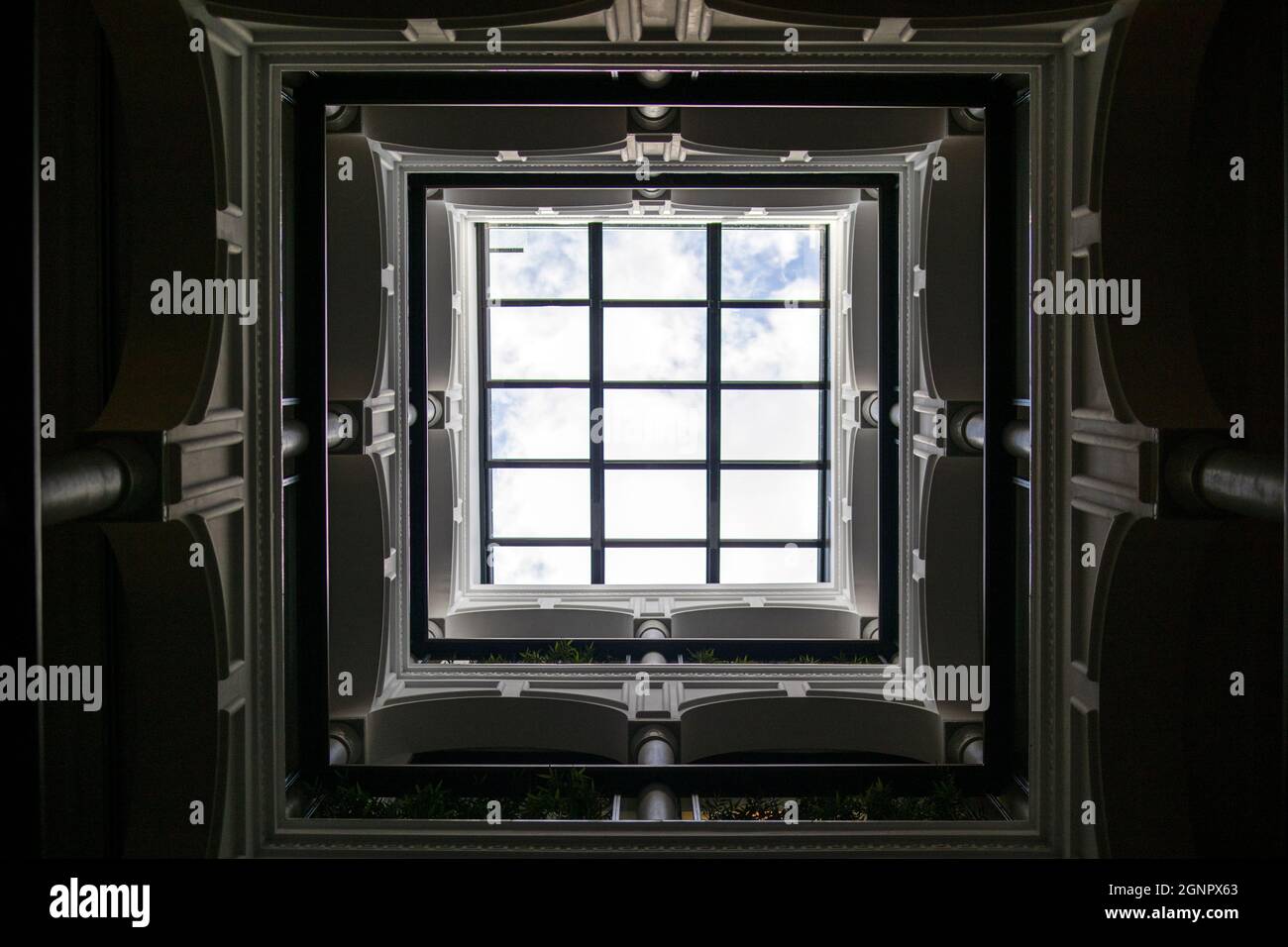 Interior of the small courtyard covered with glass in an old renovated ...