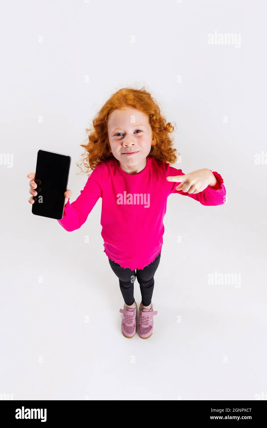 Top view portrait of little Caucasian girl, child posing isolated over ...