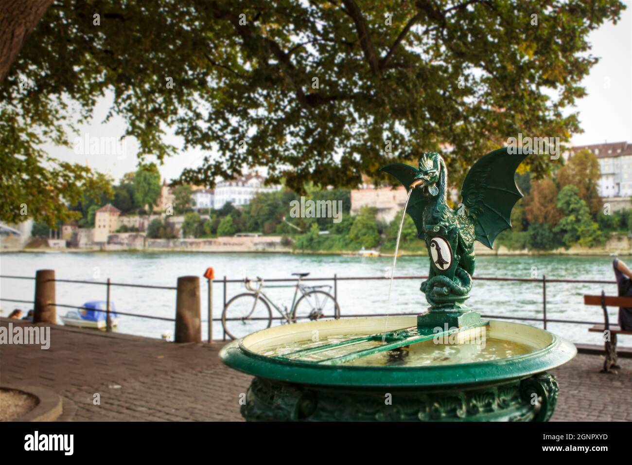 Basel, Switzerland, 24.09.21.: Basilisk fountain, Dragon drinking water ...
