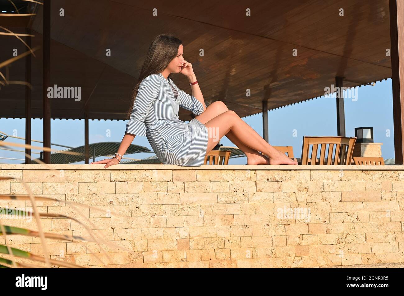 Young woman basking in the sun Stock Photo - Alamy