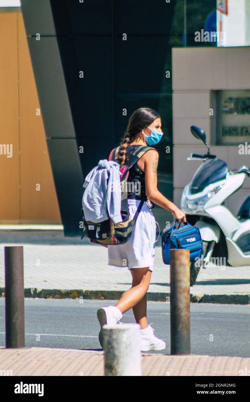 Seville Spain September 22, 2021 School girl walking in the street ...