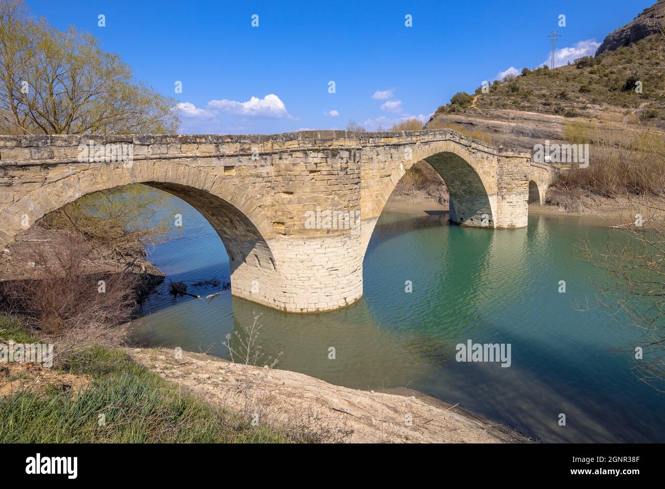 Historic arched bridge puente de abajo at Graus, Aragon, Spain Stock ...