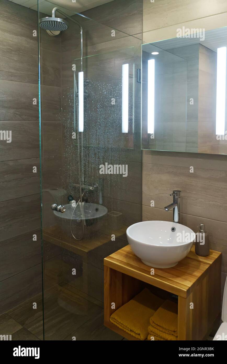 Shower cabin and sink in the bathroom Stock Photo - Alamy