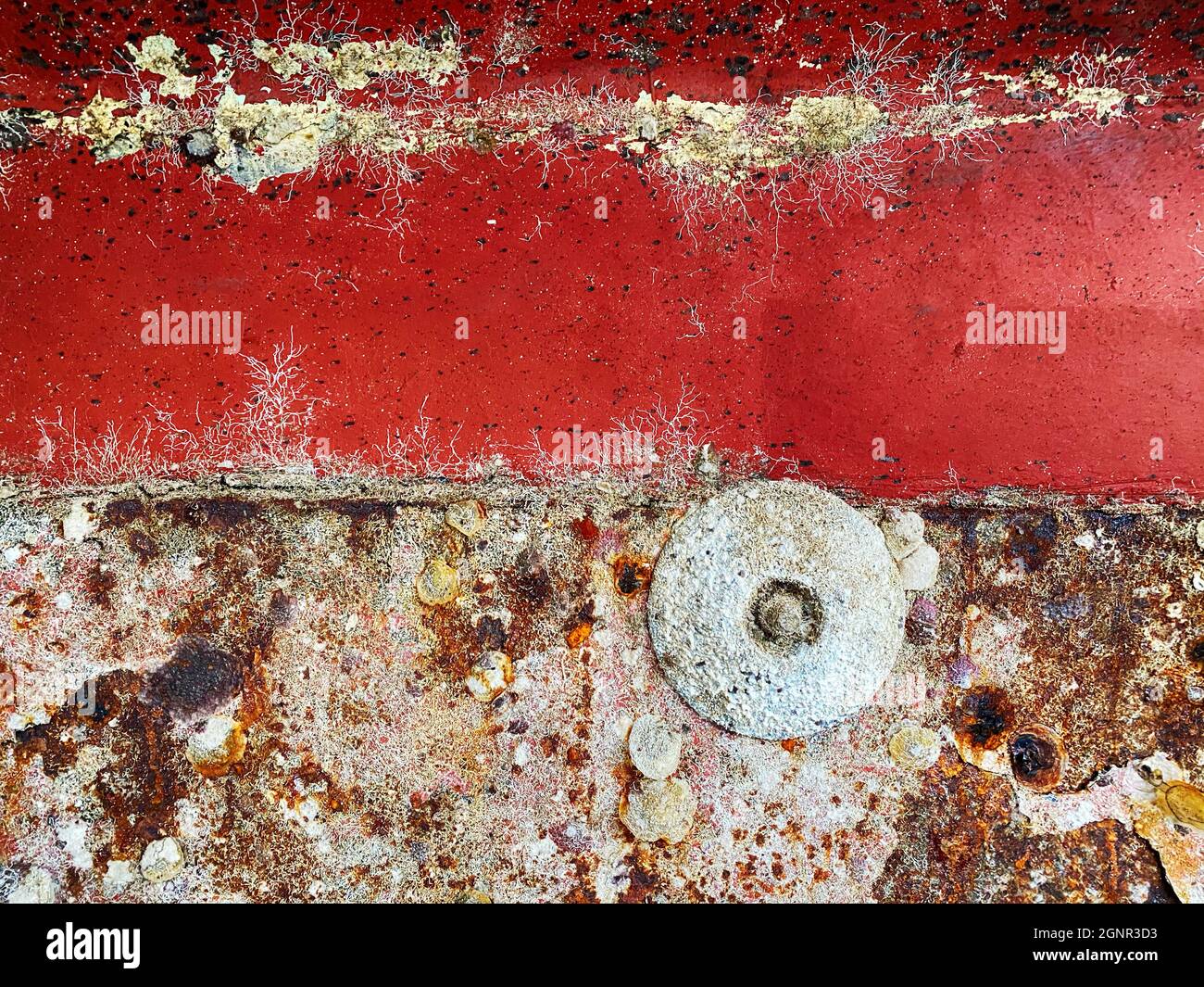 Weathered stone wall with corrosion and red paint Stock Photo - Alamy