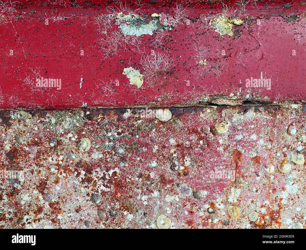 Weathered stone wall with corrosion and red paint Stock Photo - Alamy
