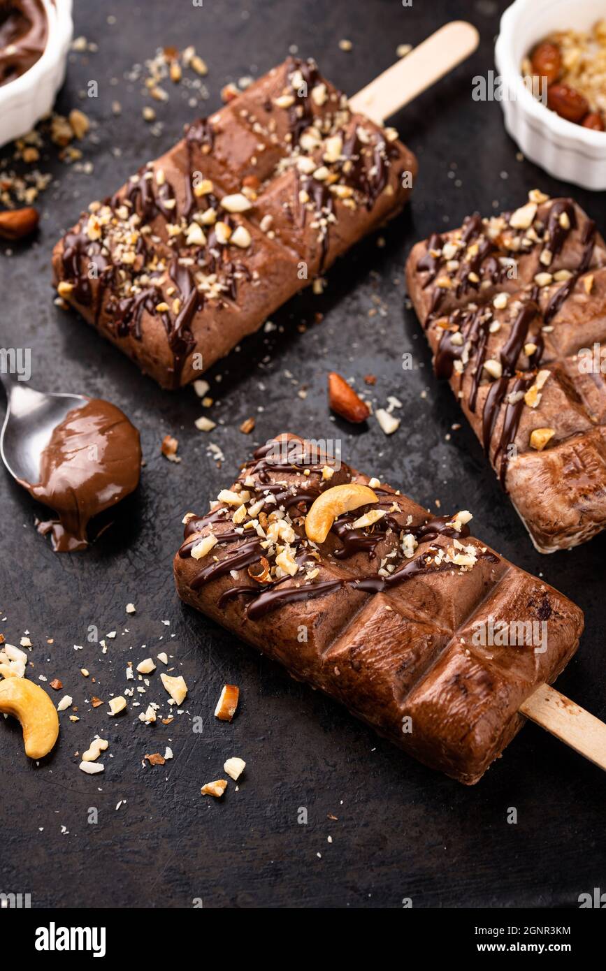 Chocolate ice cream popsicle with nut Stock Photo - Alamy