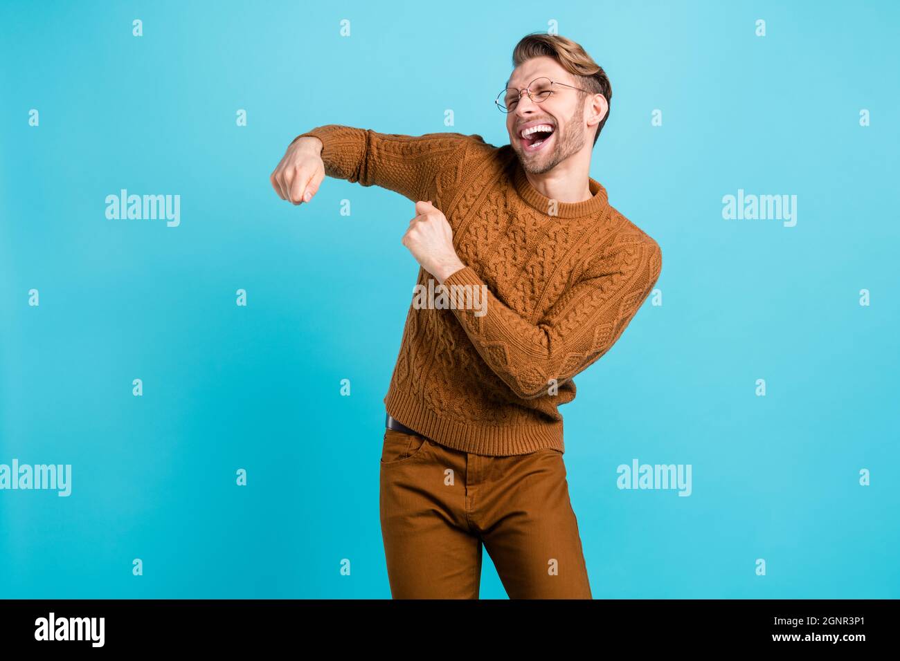 Photo of funky attractive young guy dressed knit sweater spectacles ...