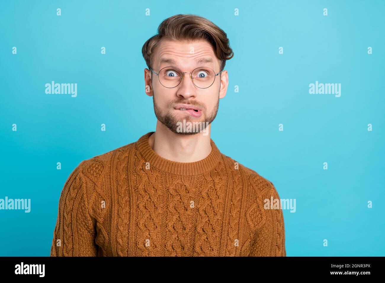 Photo of unhappy troubled young man scared face wear glasses isolated ...