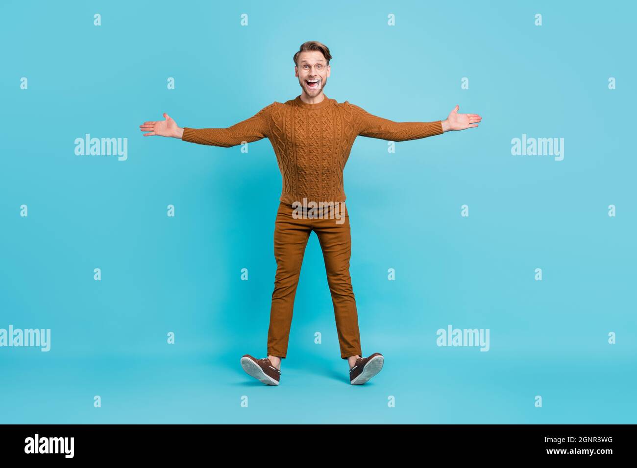 Full size photo of attractive young happy funny man open hands good ...