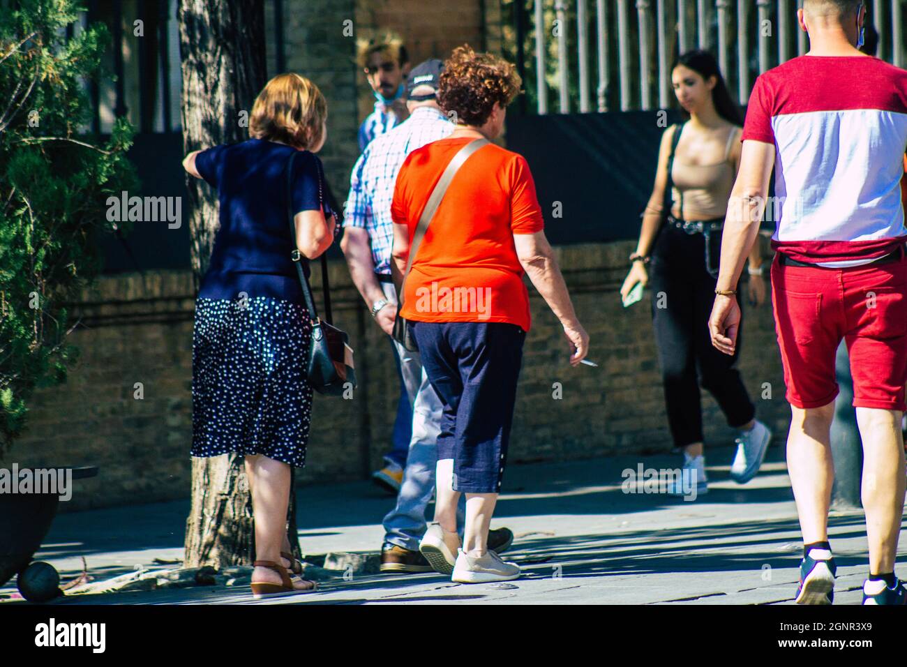 Seville Spain September 22, 2021 Pedestrians walking in the street ...
