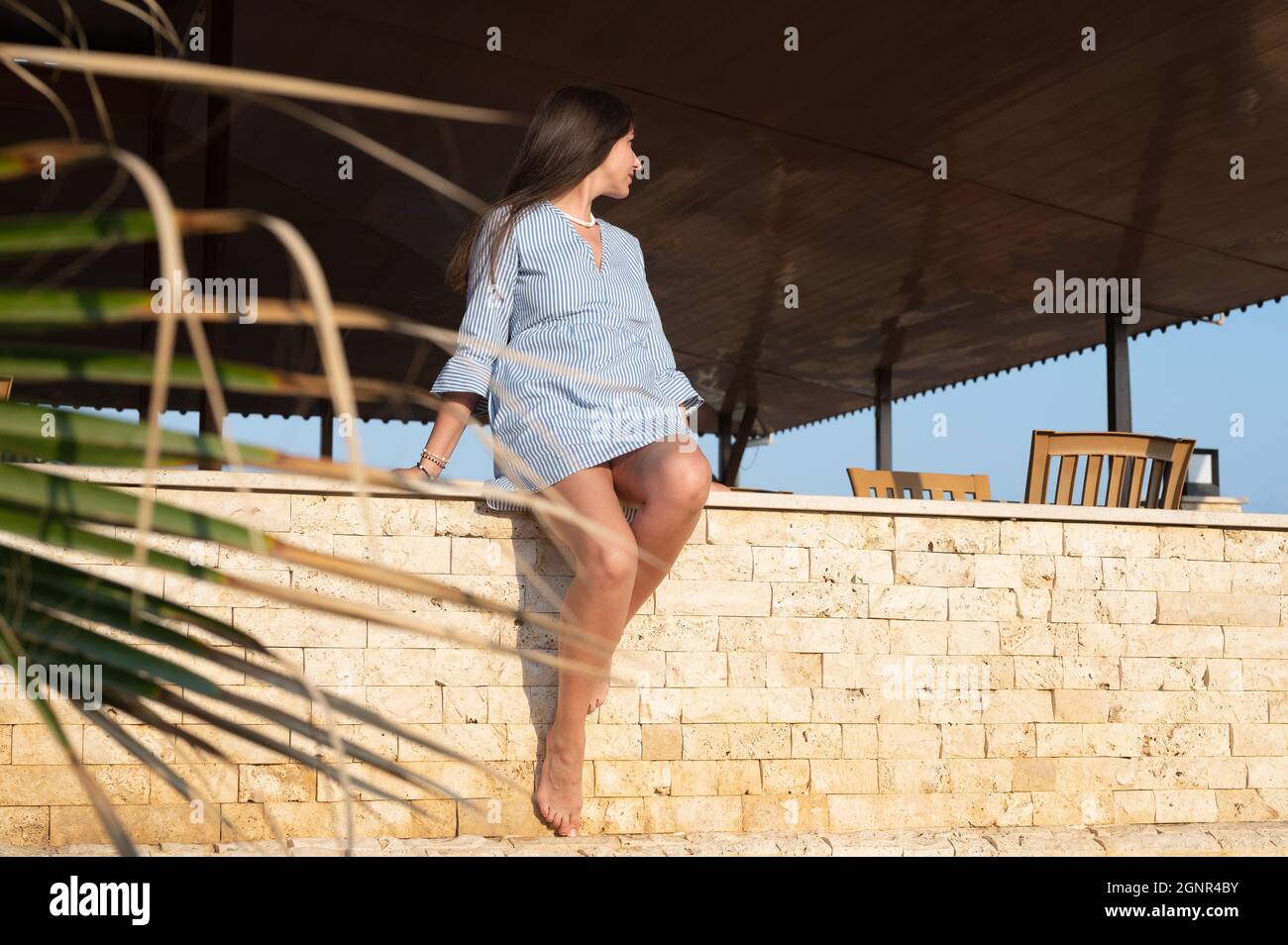Young woman basking in the sun Stock Photo - Alamy