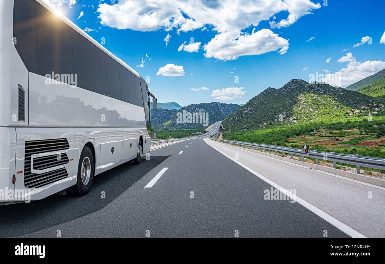 Passenger bus on the highway against the backdrop of a beautiful ...