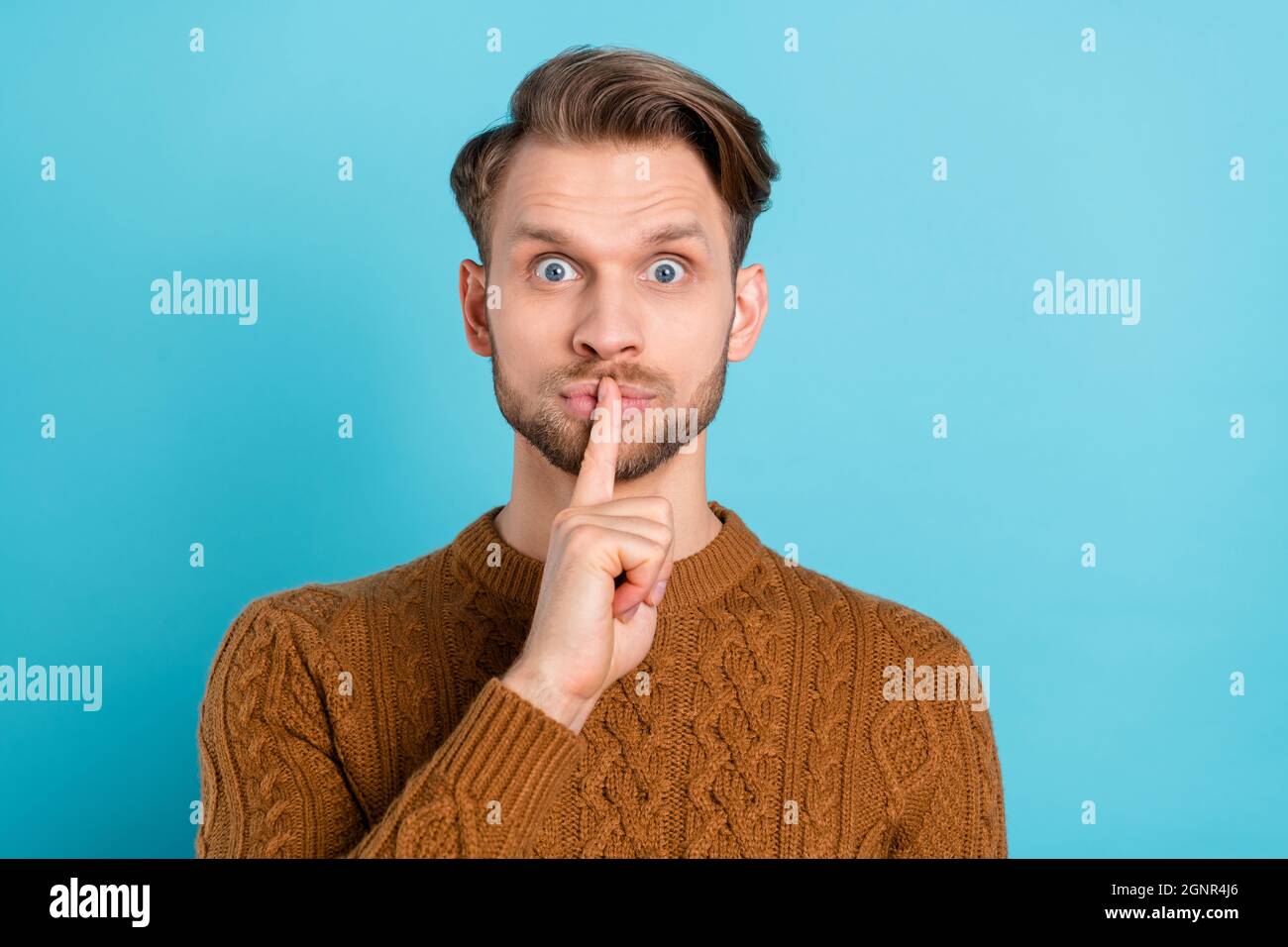 Photo of afraid scared young man hold fingers lips mouth silence face ...