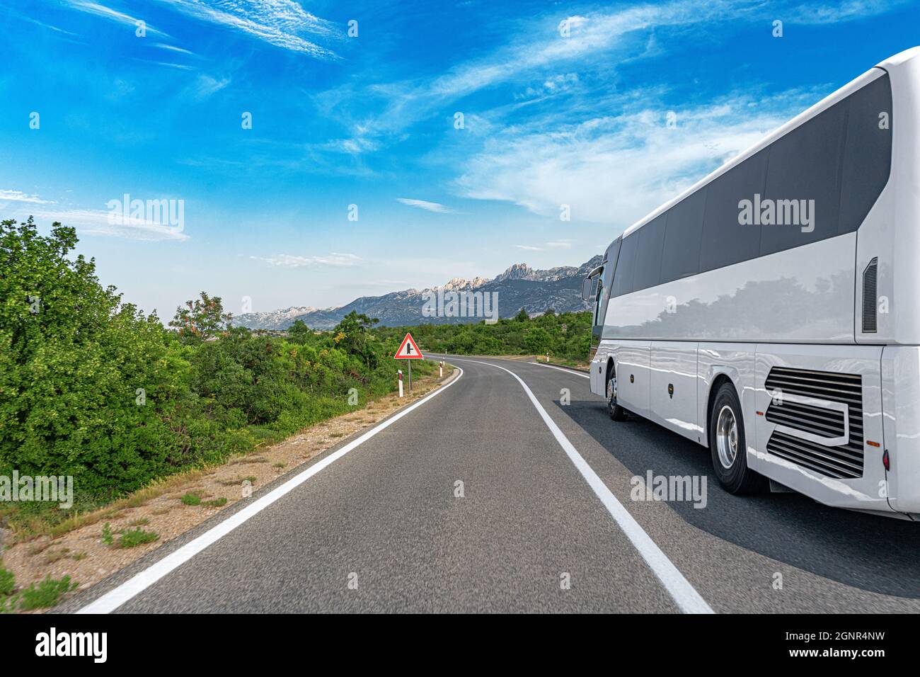 Passenger bus on the highway against the backdrop of a beautiful ...