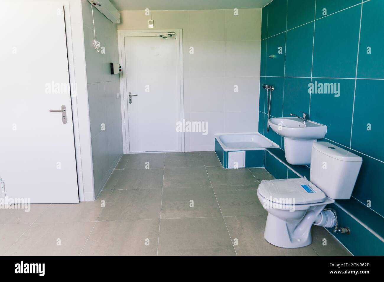 View of new toilet and bathroom interior for hospital, white and clean ...