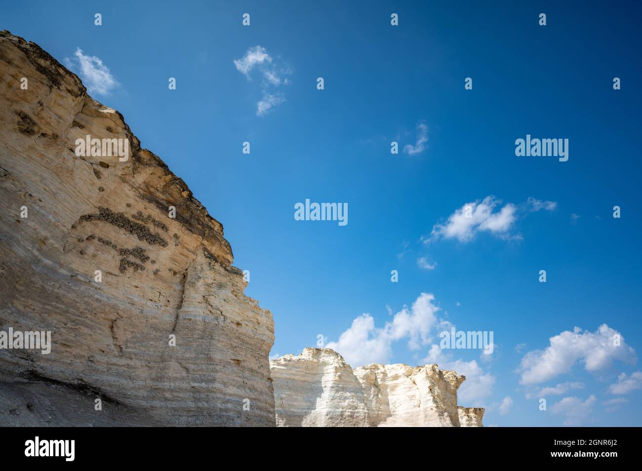 Cliff swallow mud homes built into the cliff face of Monument Rocks in ...