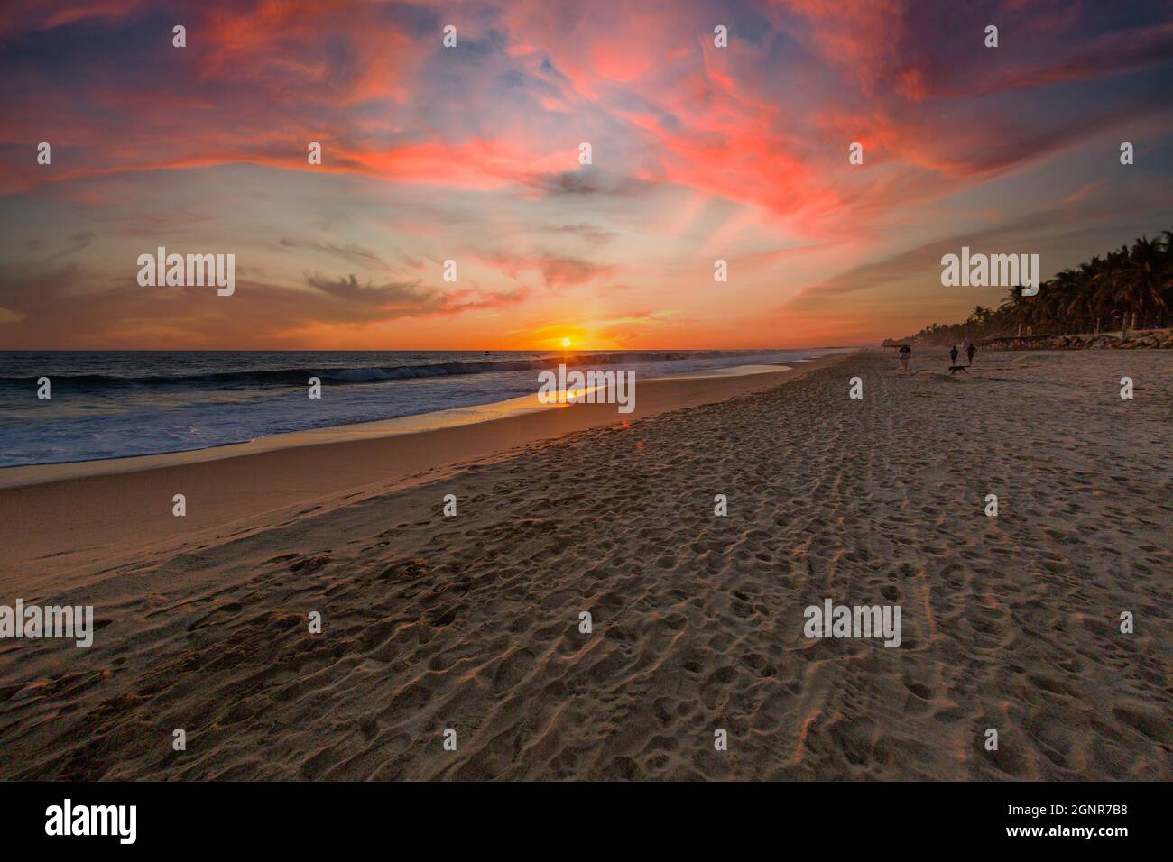 Beach at the sunset Stock Photo - Alamy