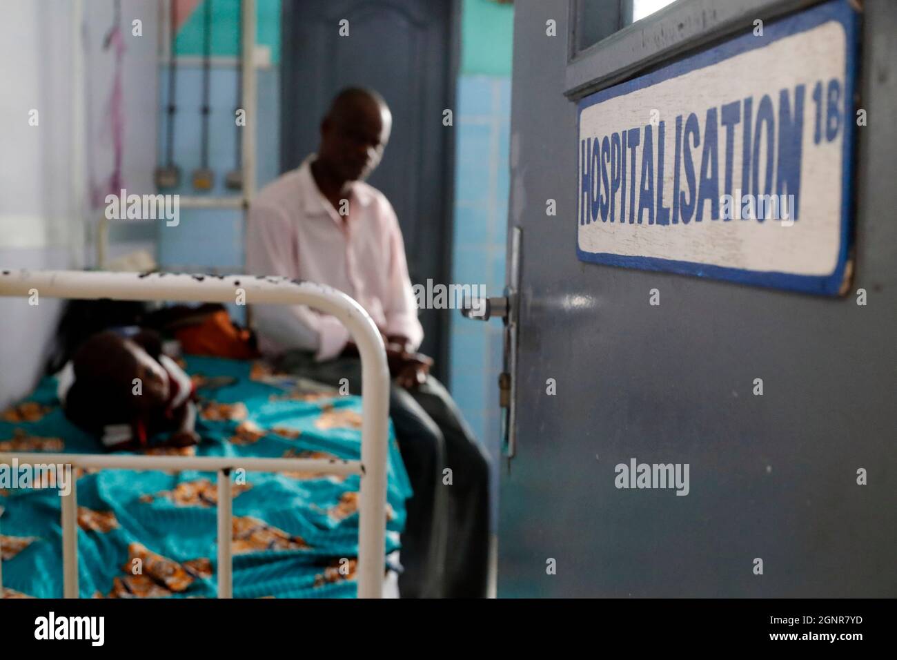 African hospital. Pediatric ward. Father and son in room. Benin Stock ...
