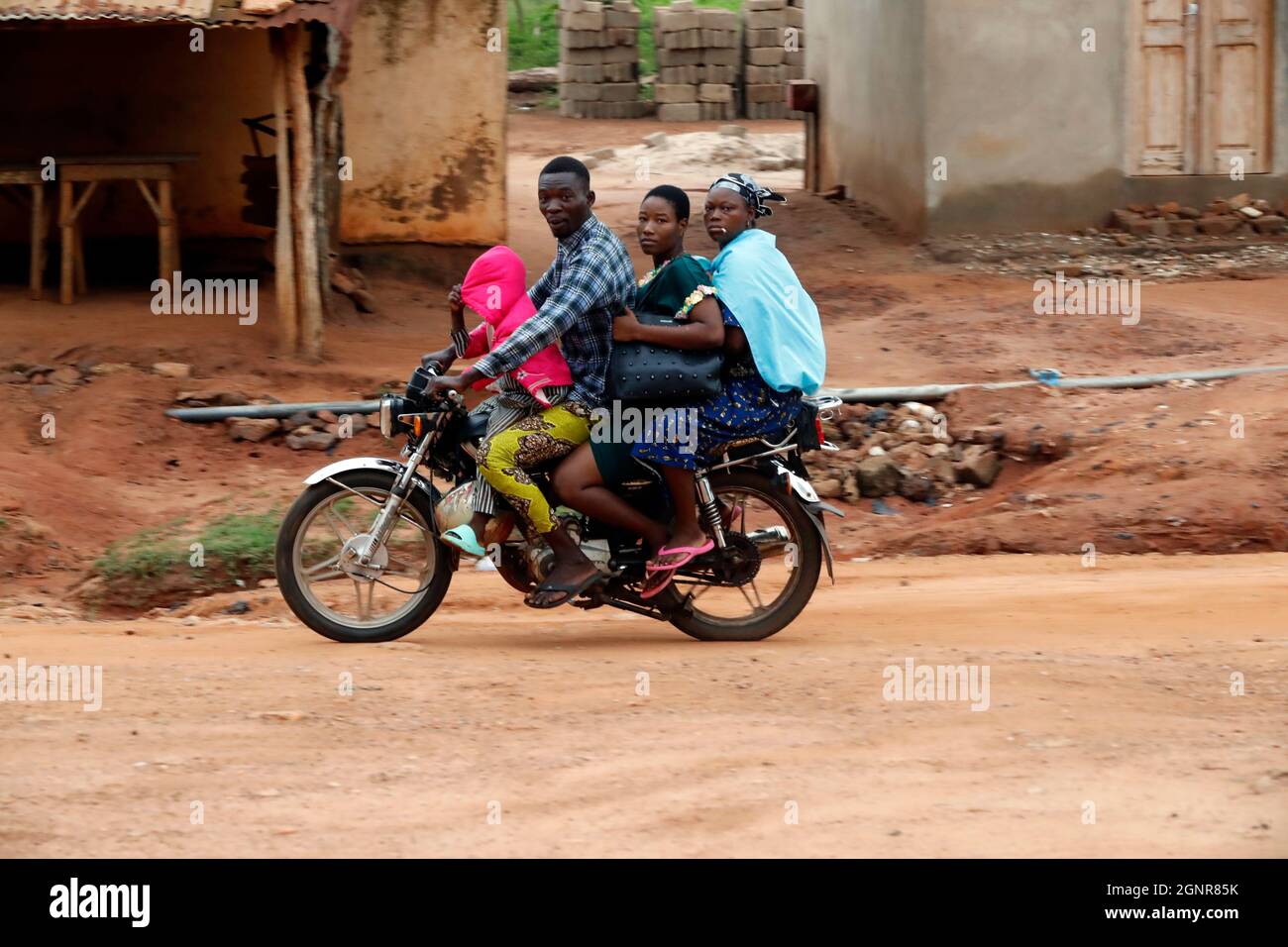 African family riding a motorcycle on the road. Benin Stock Photo - Alamy