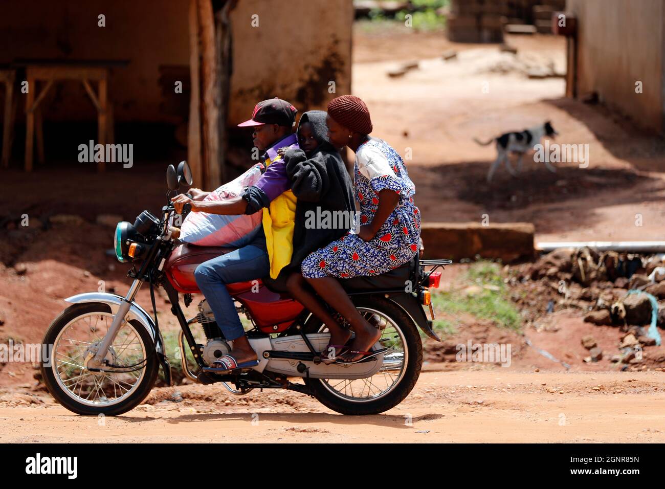 African family riding a motorcycle on the road. Benin Stock Photo - Alamy