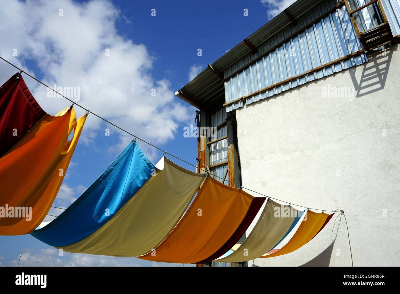 Colorful clothes on the rope Stock Photo - Alamy