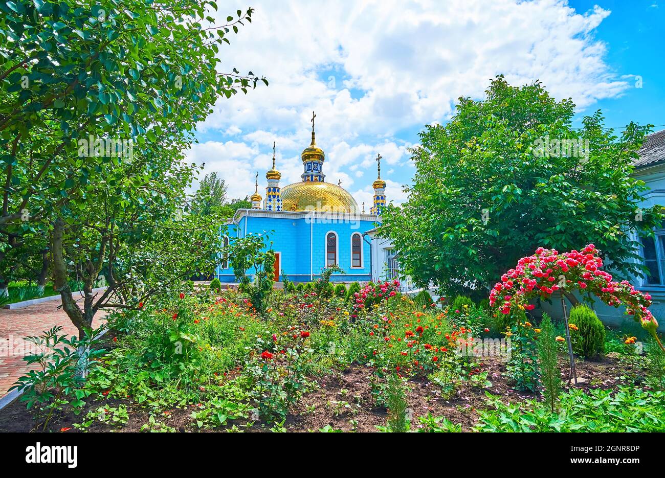 The colorful flower beds with blooming roses in garden of Archangel ...
