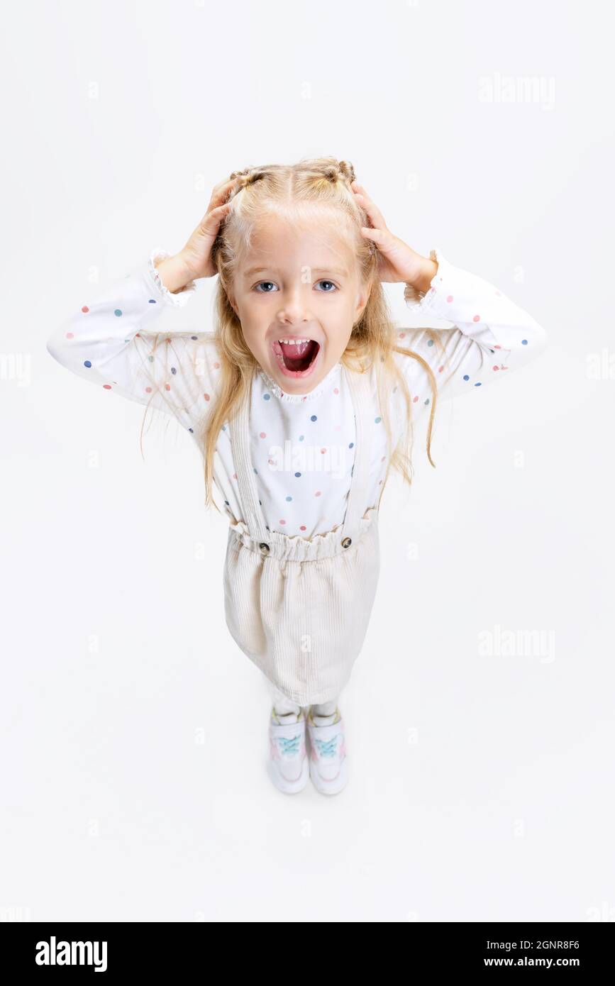 Top view portrait of little Caucasian girl, child posing isolated over ...