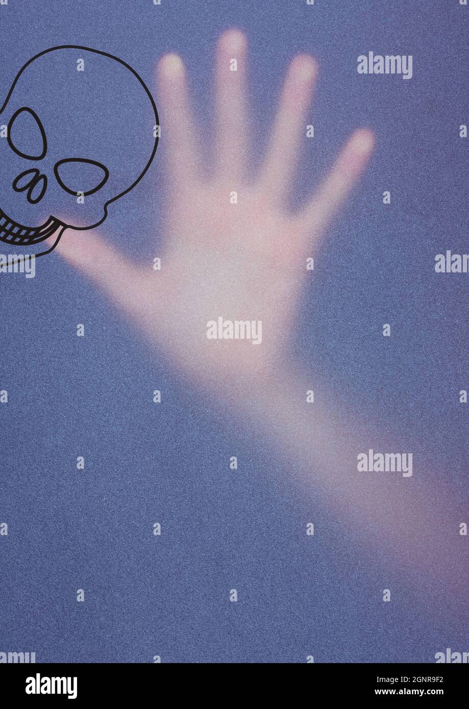 Human skull icon and noise effect overlay over trapped hand against ...