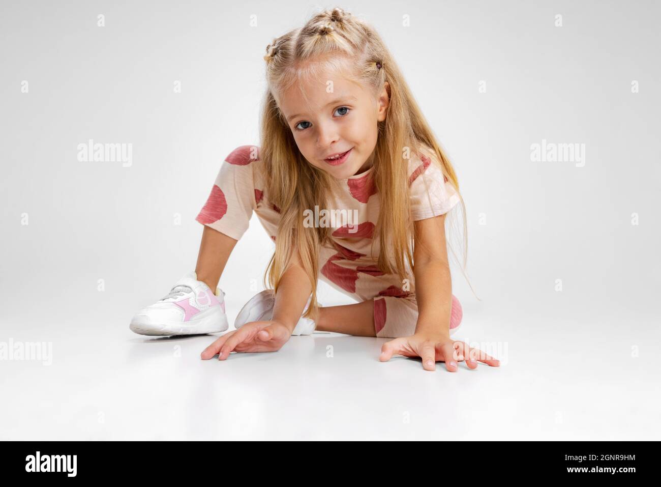Full-length portrait of little Caucasian girl, child posing isolated ...